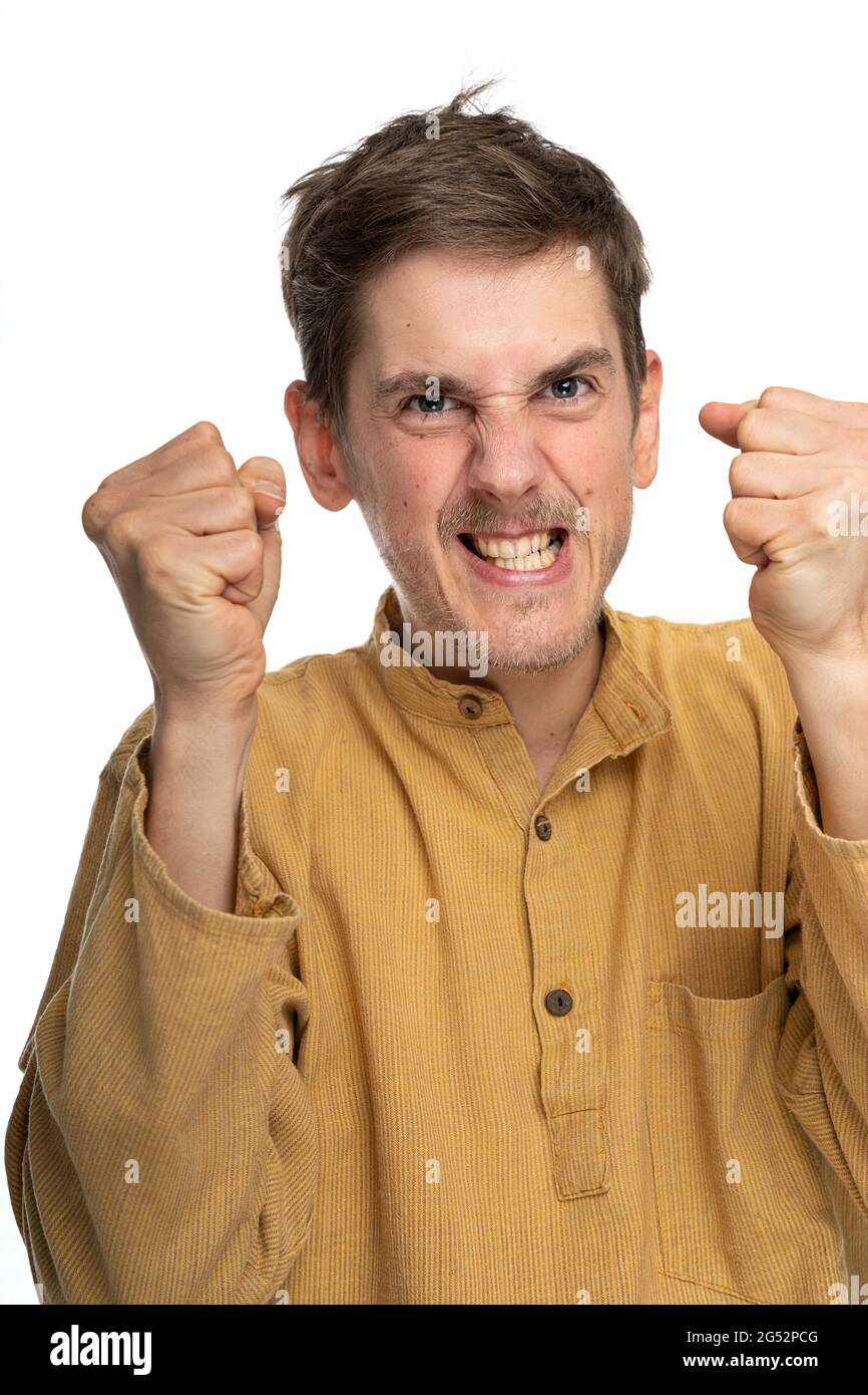 Young handsome tall slim white man with brown hair looks furious in ...