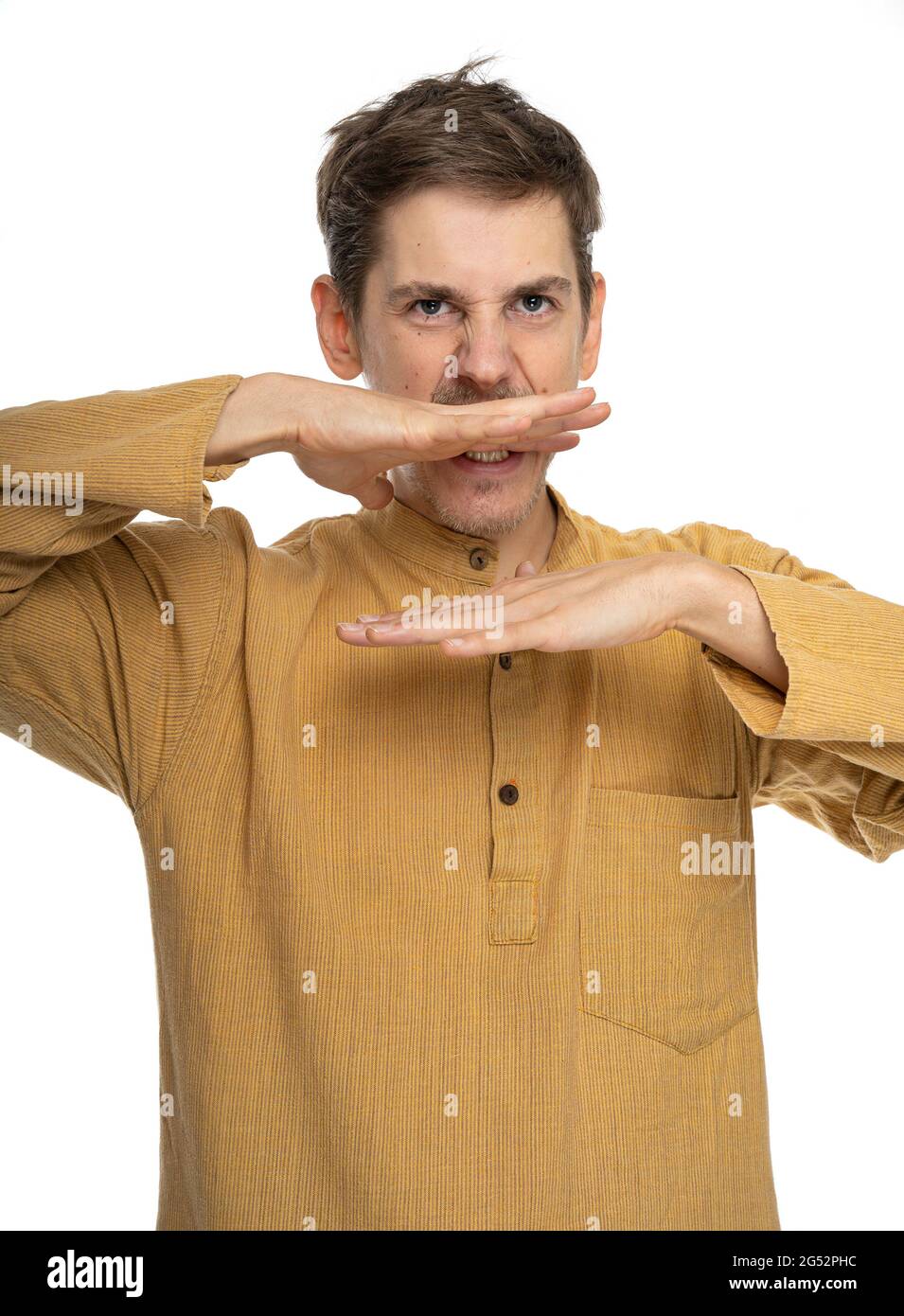 Young handsome tall slim white man with brown hair looks angry with his ...