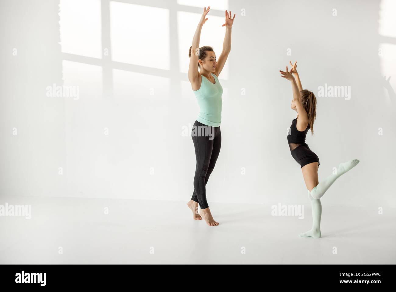 Woman with a little girl on rhythmic gymnastics training Stock Photo ...