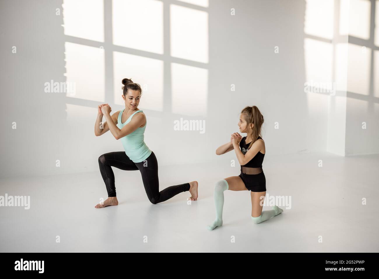 Woman with a little girl on rhythmic gymnastics training Stock Photo ...