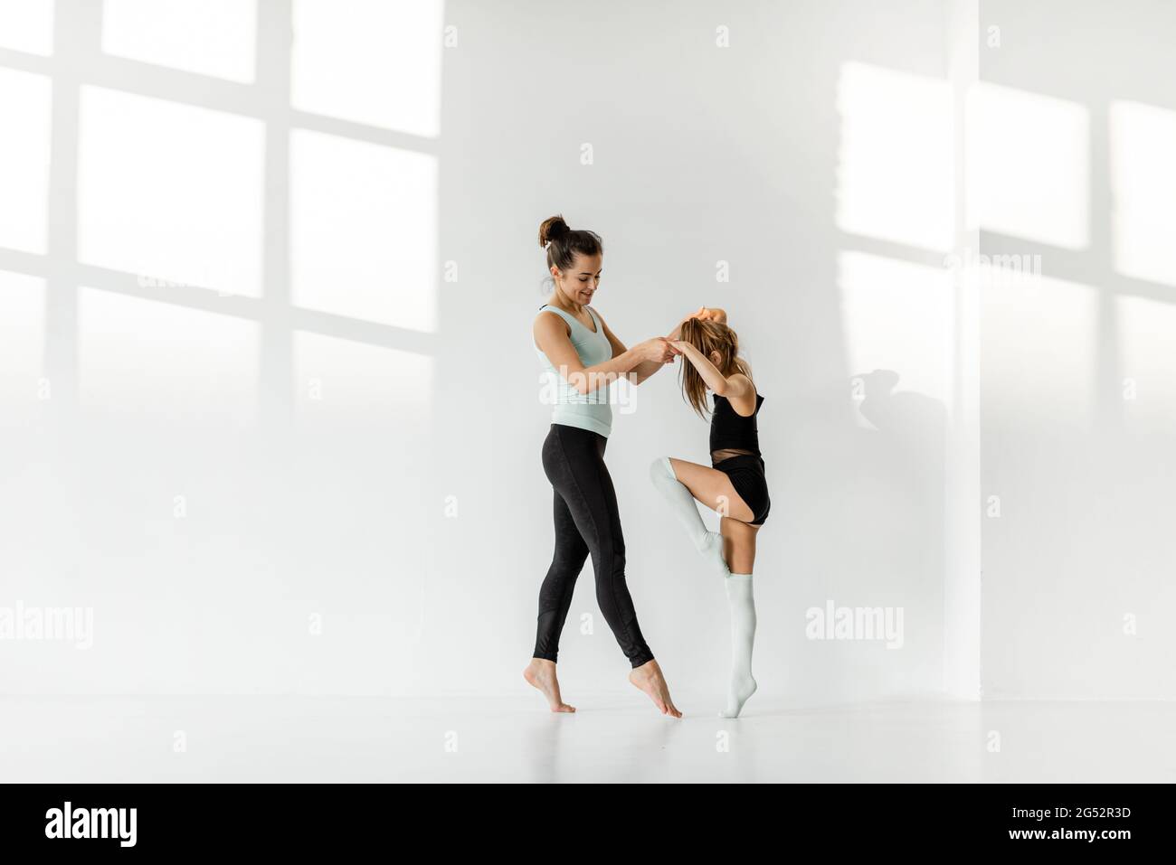 Woman with a little girl on rhythmic gymnastics training Stock Photo ...
