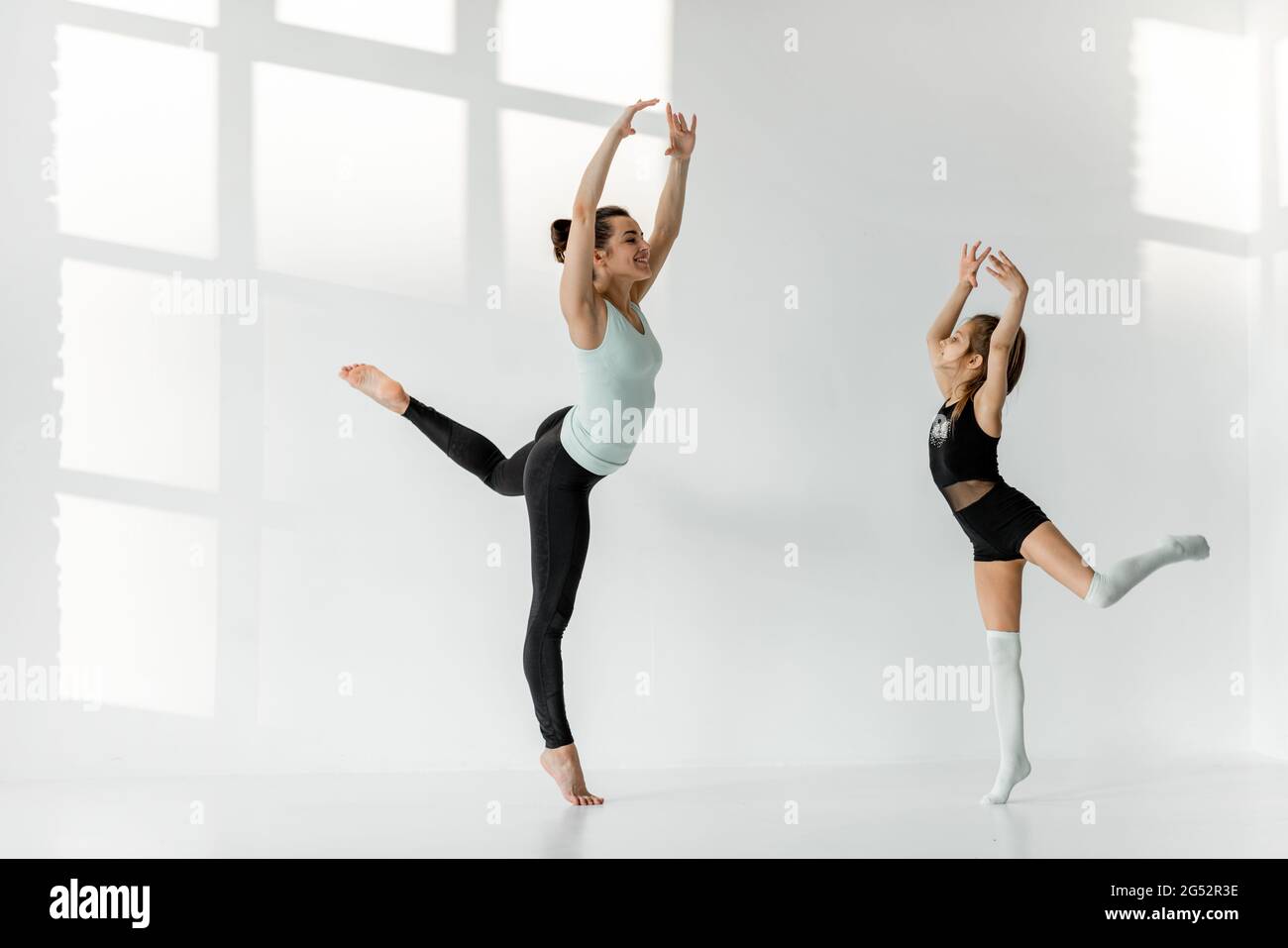 Woman with a little girl on rhythmic gymnastics training Stock Photo ...