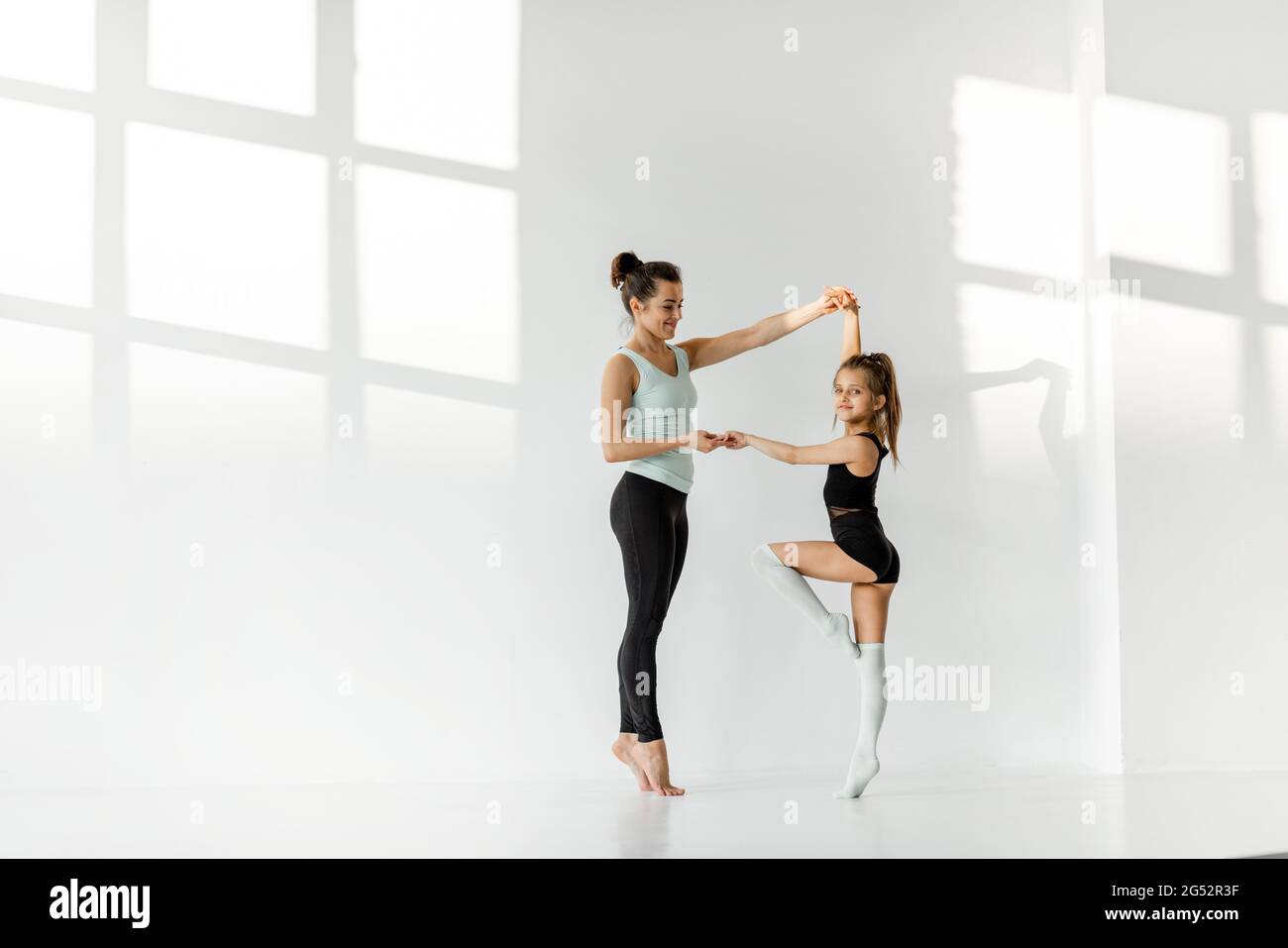 Woman with a little girl on rhythmic gymnastics training Stock Photo ...