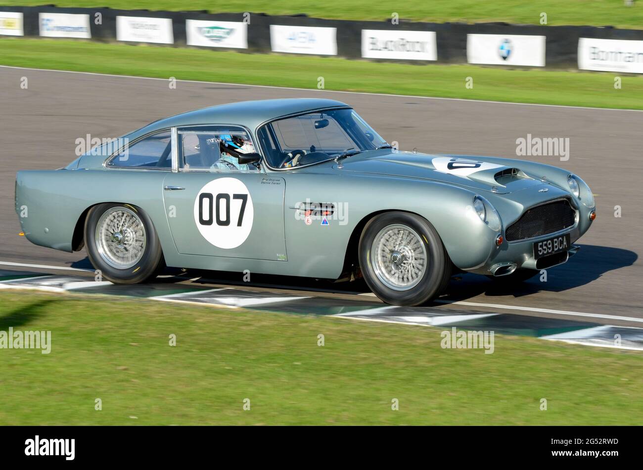 Aston Martin DB4 GT classic car number 007 driving at Goodwood Revival ...
