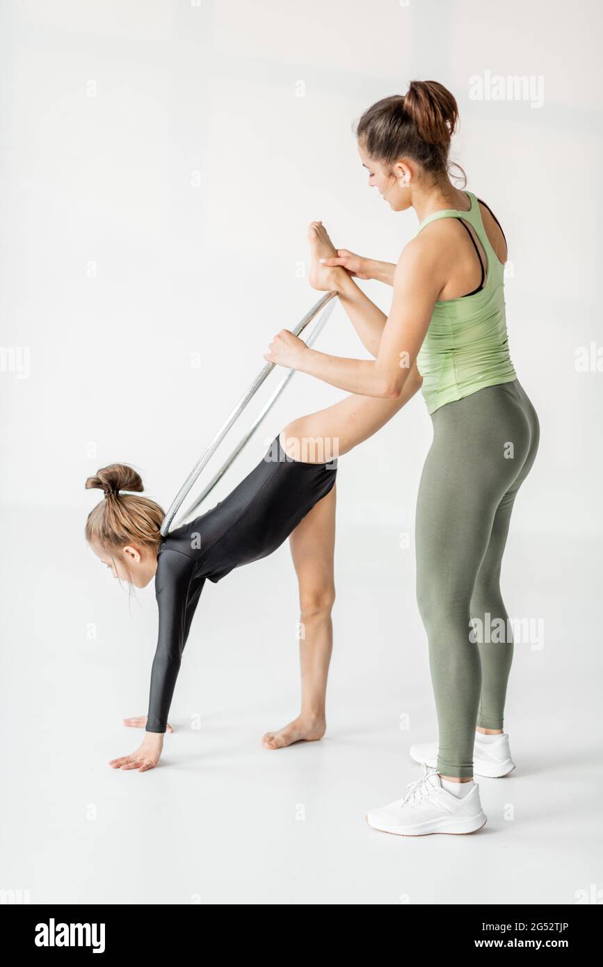 Woman with a little girl on rhythmic gymnastics training Stock Photo ...