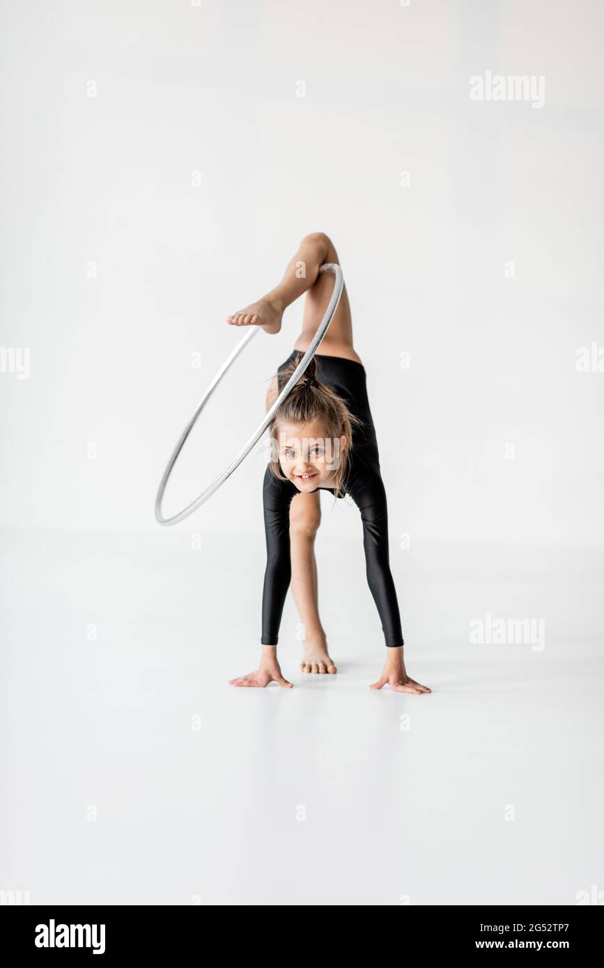 Girl practising rhythmic gymnastic with a ring Stock Photo - Alamy