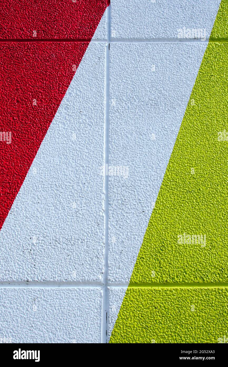 wall of red white and yellow colors on a building exterior Stock Photo ...