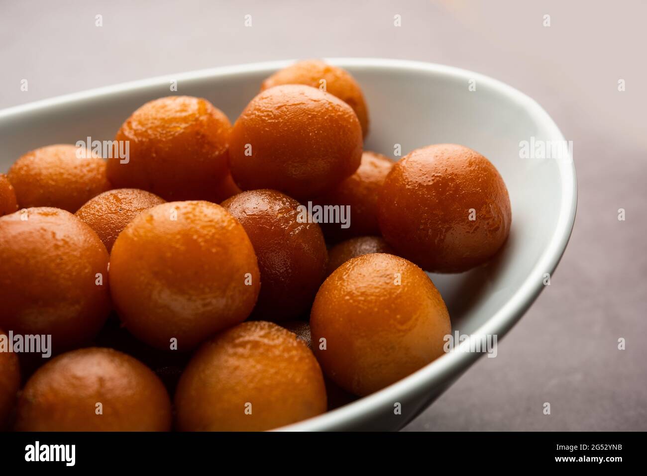 Gulab jamun is a milk-solid-based sweet dumpling popular in India ...