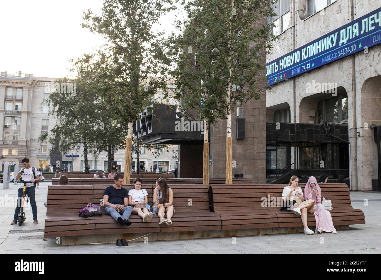 Moscow, Russia - 21 June 2021, People sit on benches near the TASS ...