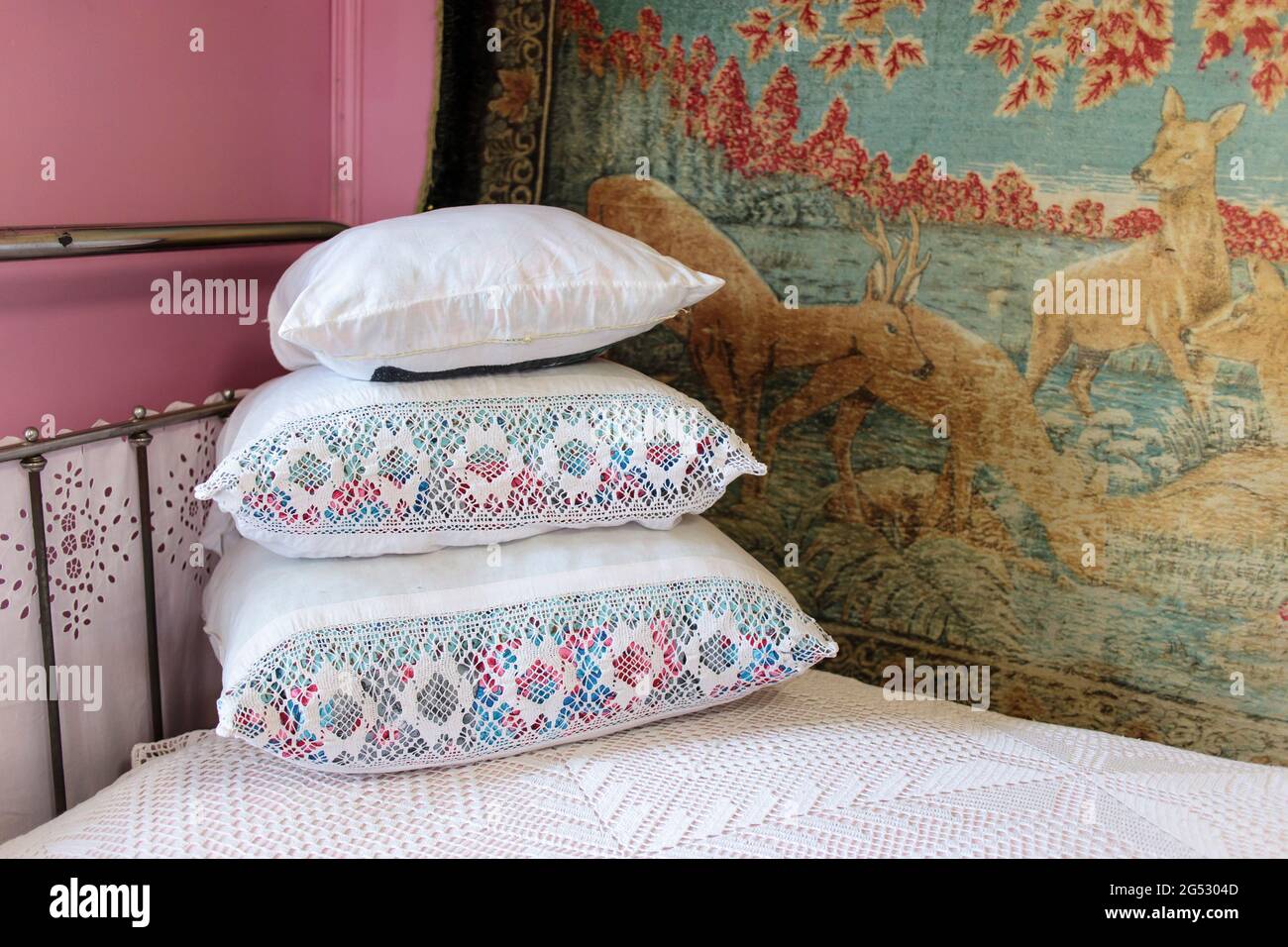 Moscow, Russia - 20 June 2021, Fragment of a Russian hut. Bed with lots ...