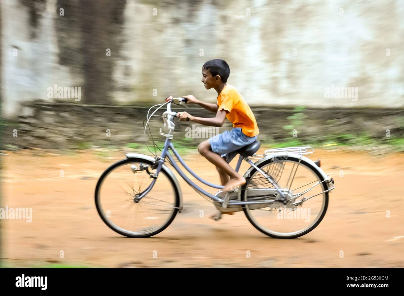 Boy welling bike in action Stock Photo - Alamy