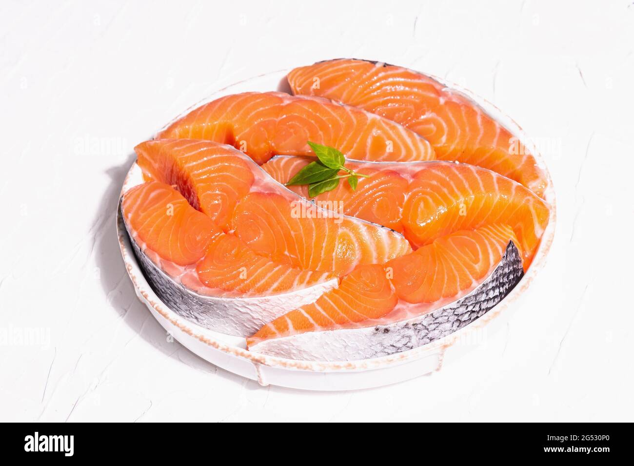 Fresh raw salmon or trout fish fillet steaks. Minimalistic design ...