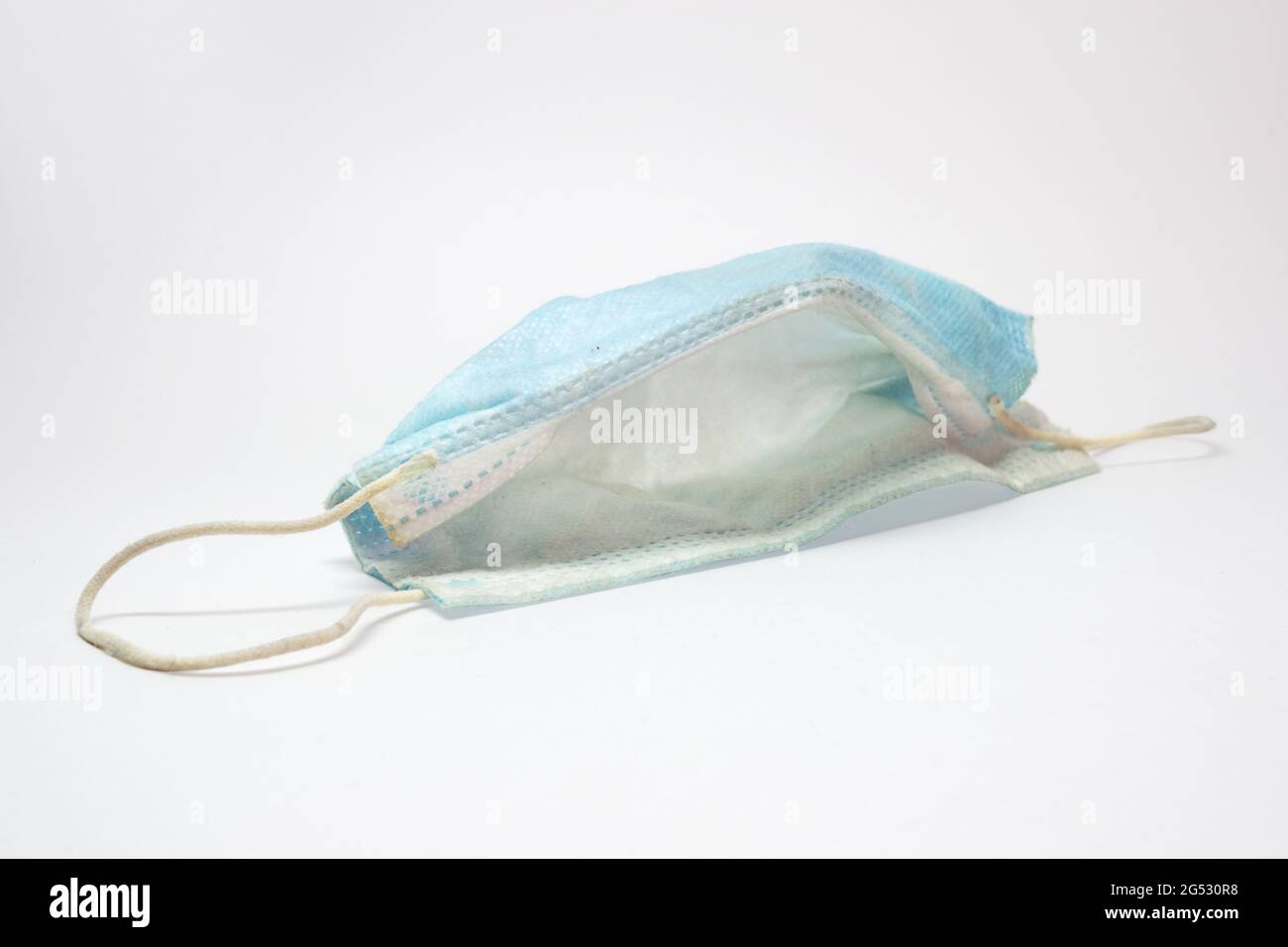 medical hygiene mask in blue color with elastic earloop Stock Photo - Alamy