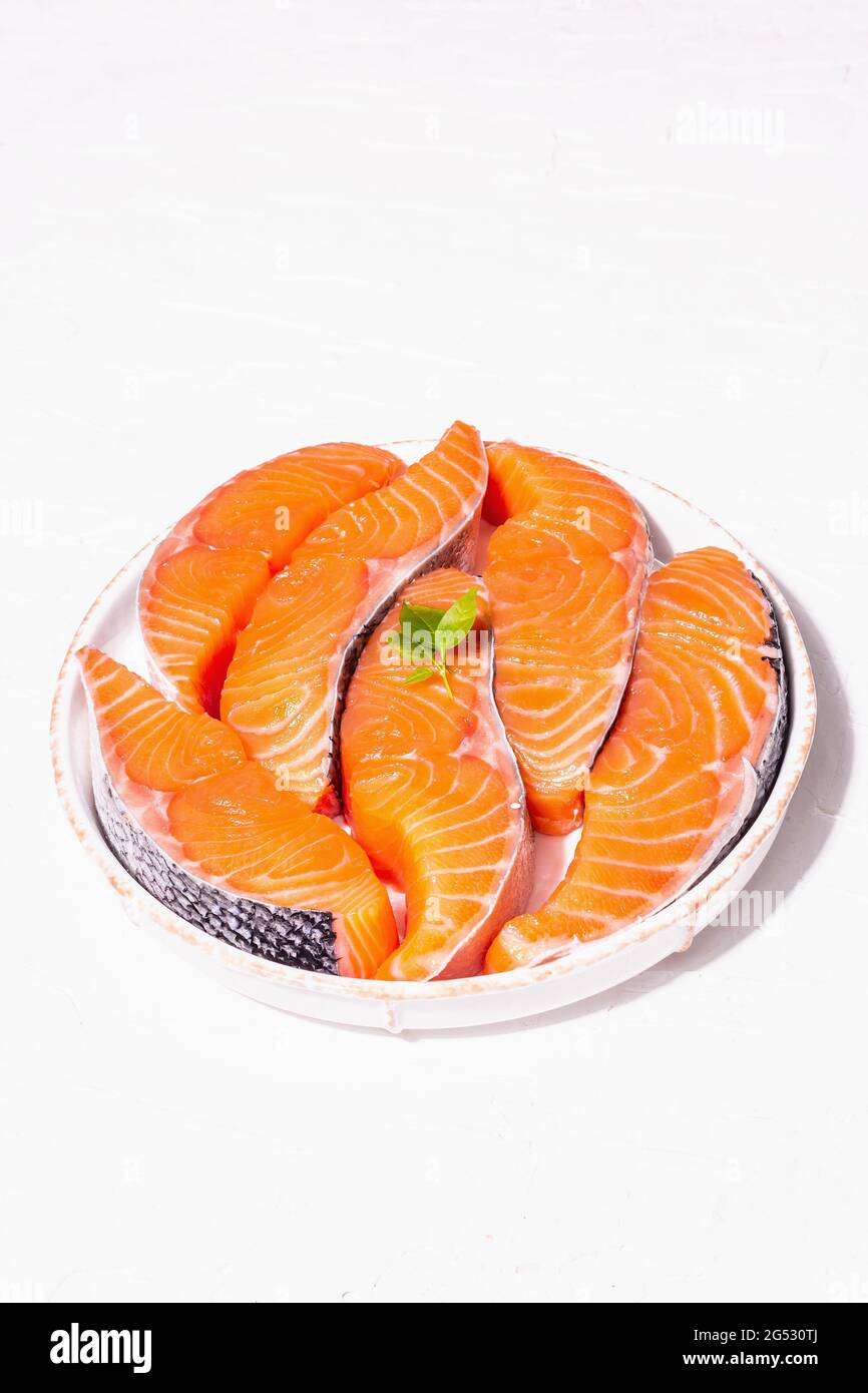 Fresh raw salmon or trout fish fillet steaks. Minimalistic design ...