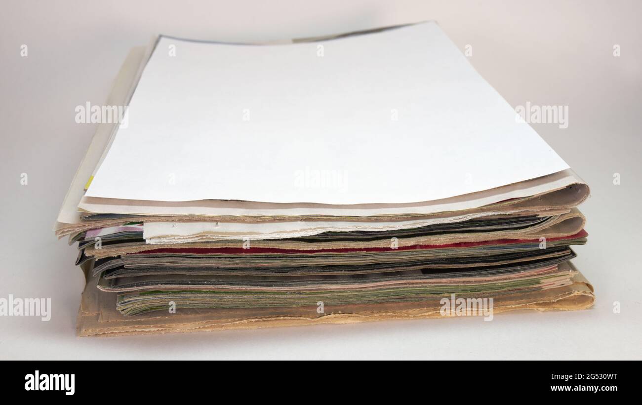 neat stack of newspapers and magazines Stock Photo - Alamy