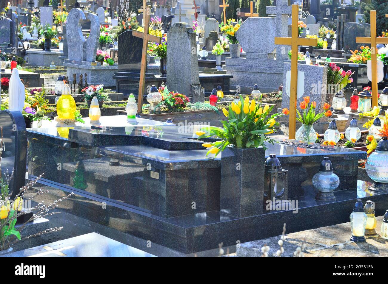 Graves in a Catholic cemetery by day. Summer Stock Photo - Alamy