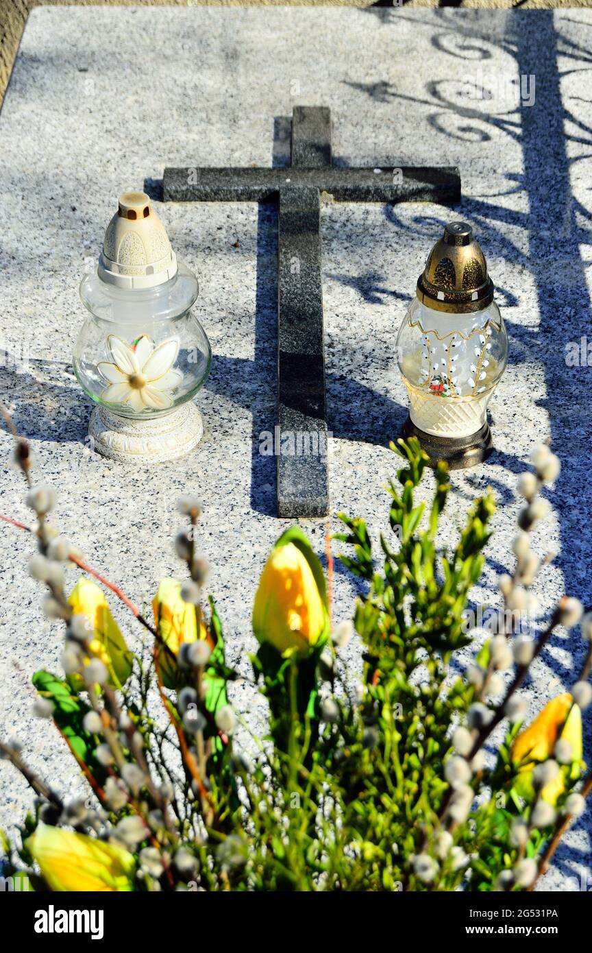 A cross on a grave in a Catholic cemetery by day. Summer Stock Photo ...