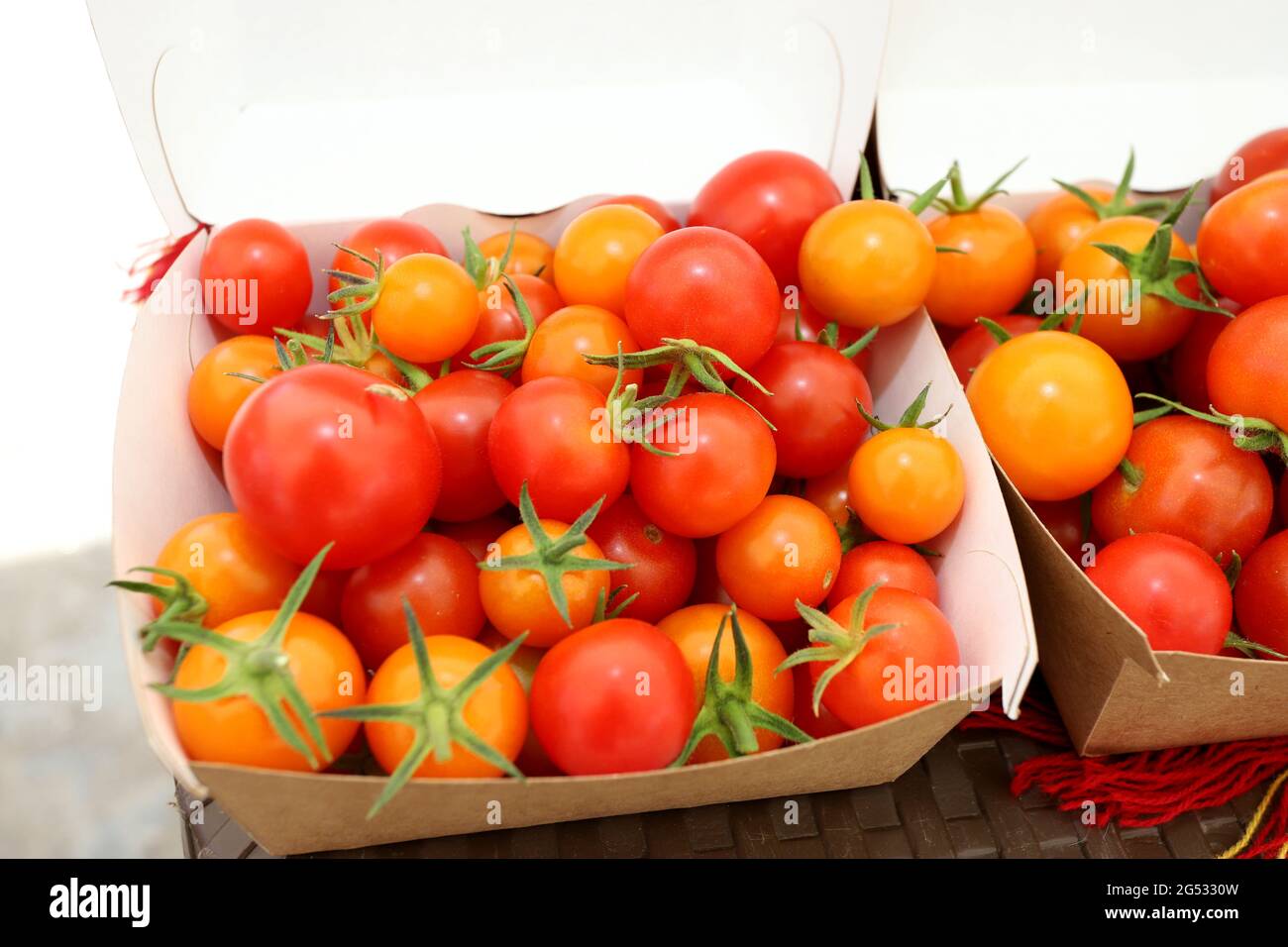 Colorful Cherry tomatoes in cardboard boxes, healthy snacks Stock Photo ...