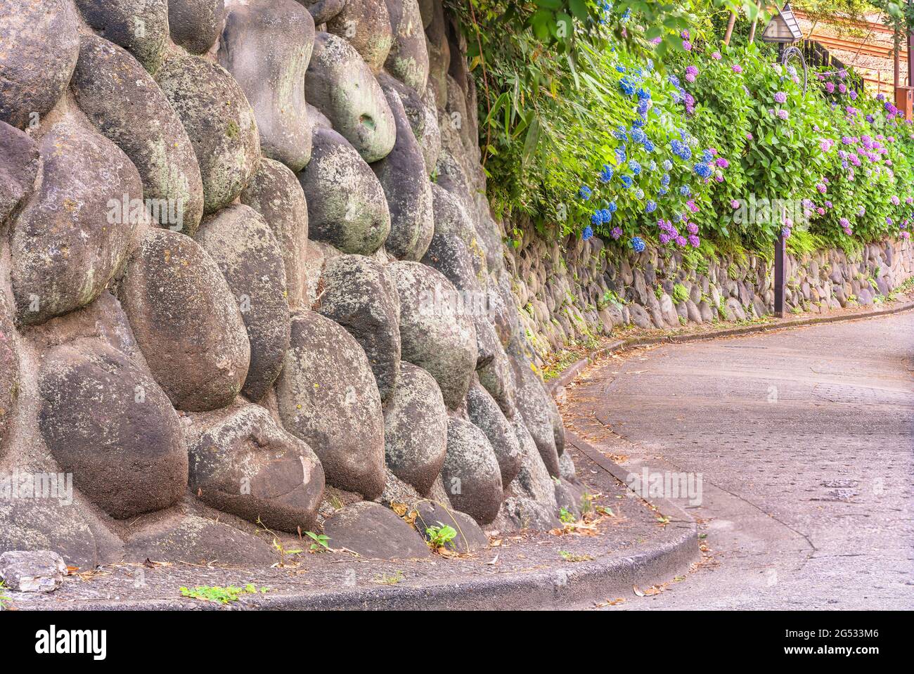 tokyo, japan - june 15 2021: Close up on a dry stone retaining wall ...