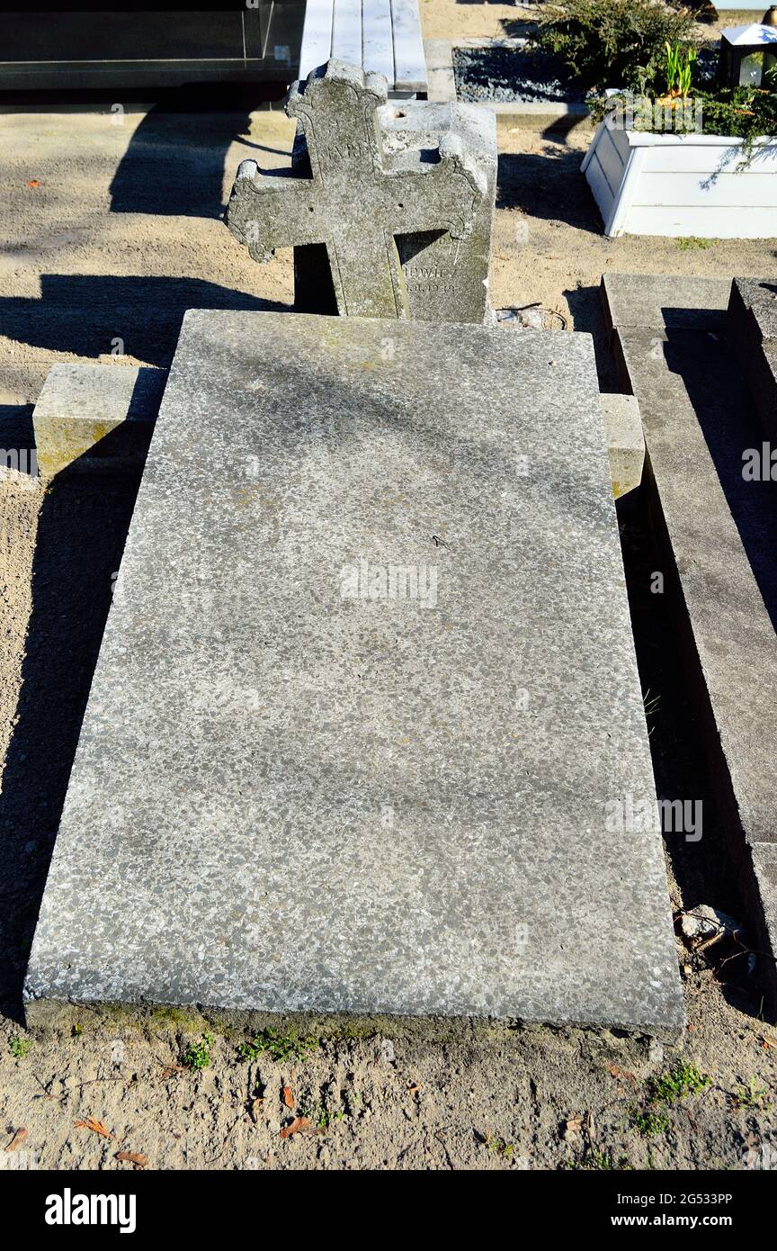 A cross on a grave in a Catholic cemetery by day. Summer Stock Photo ...