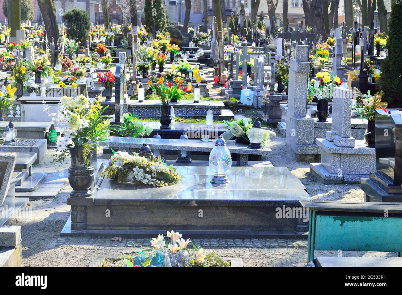 Graves in a Catholic cemetery by day. Summer Stock Photo - Alamy
