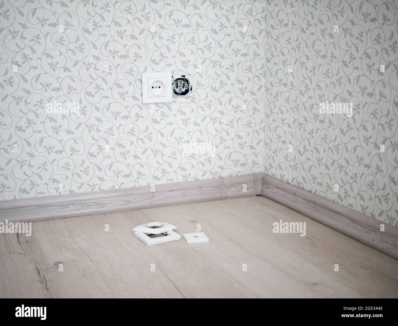 Unrepaired electrical outlet in the wall in the new empty apartment ...