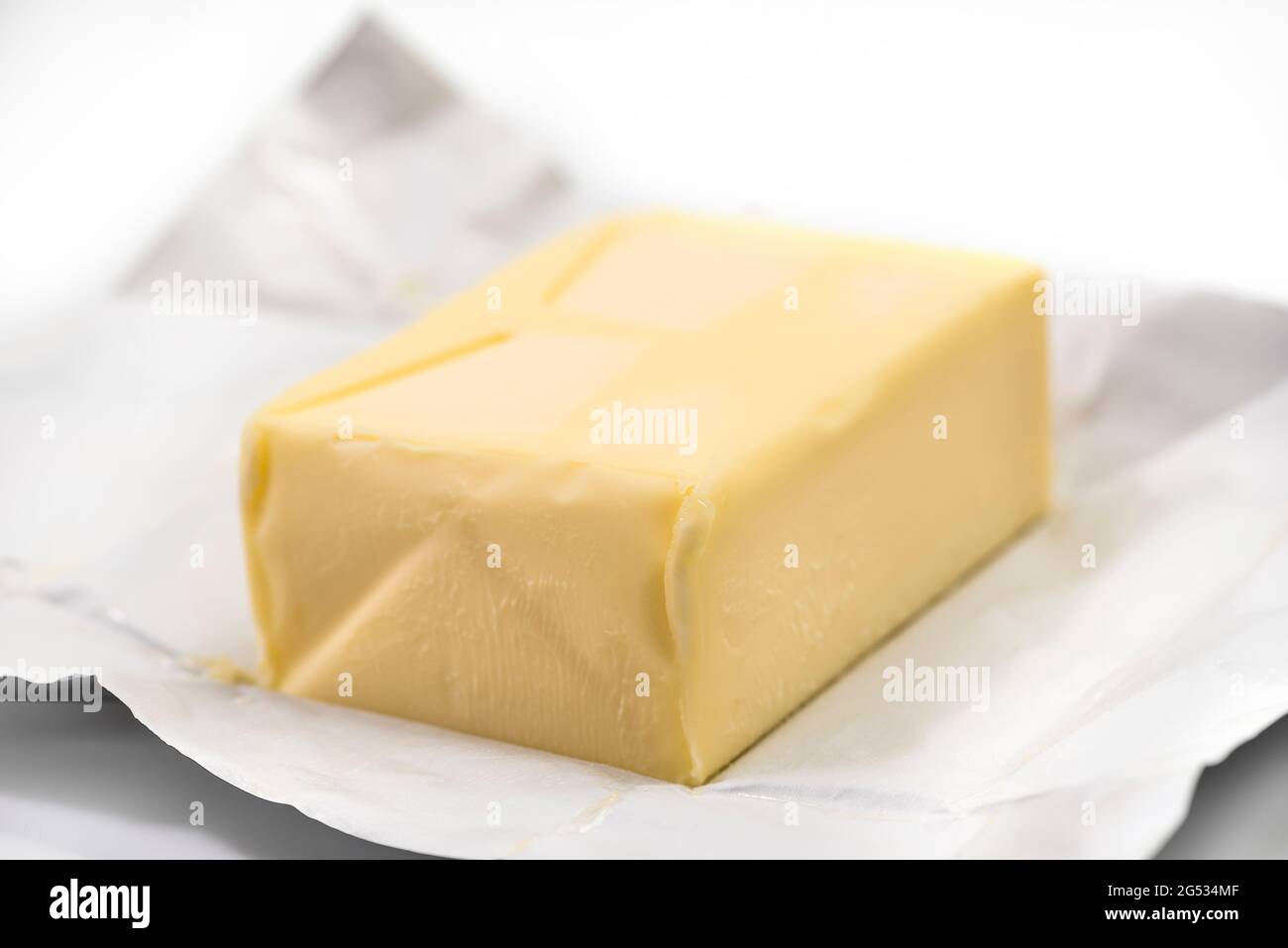 Traditional butter block unwrapped for use as a baking ingredient ...