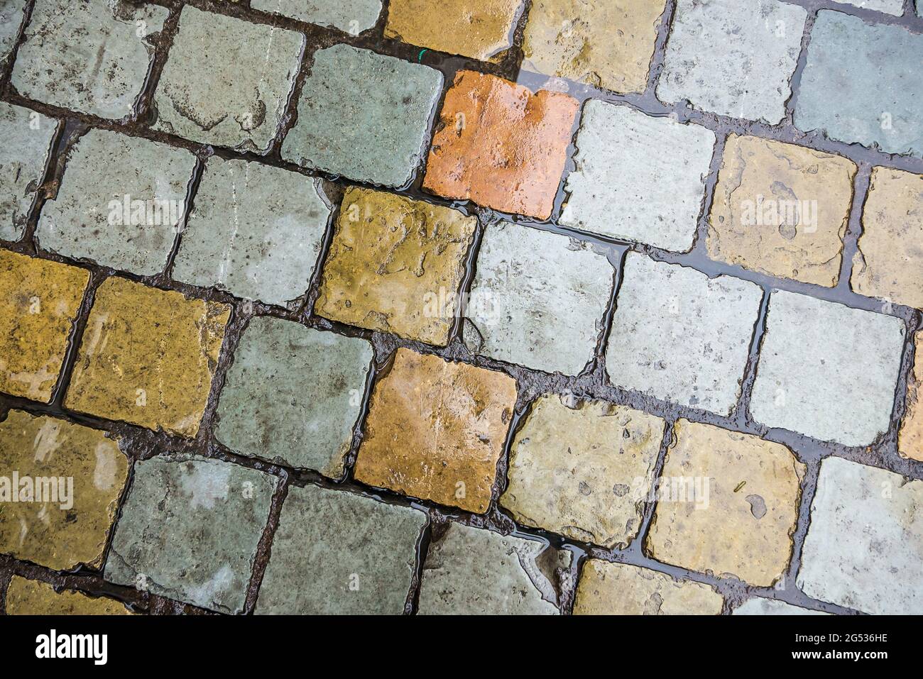 Wet from the rain colorful brick tiles diagonal background Stock Photo ...