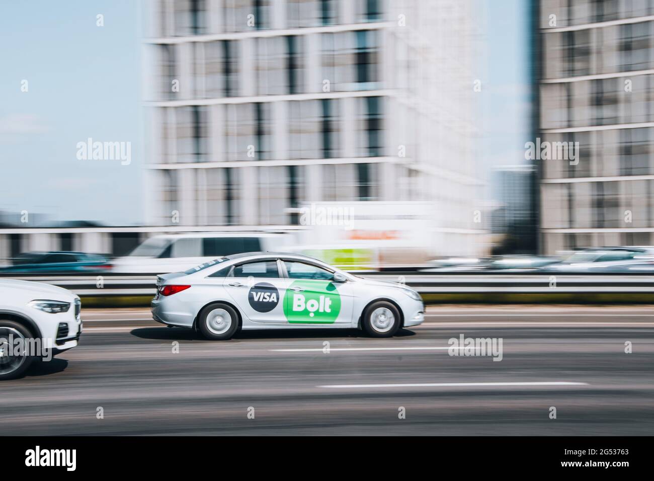 Ukraine, Kyiv - 29 April 2021: White Toyota HiAce Taxi Bolt car moving ...