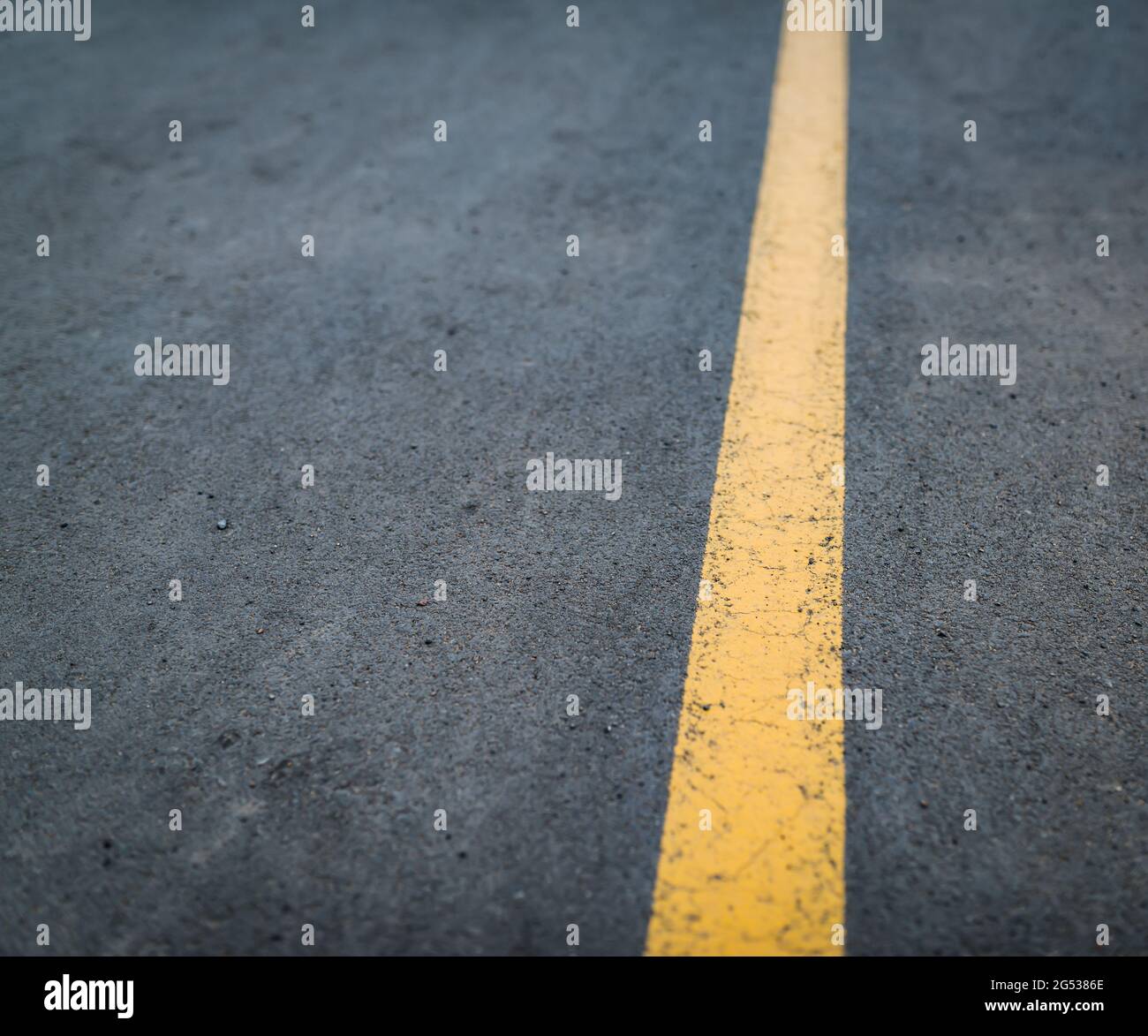 Empty asphalt road with yellow line on right side Stock Photo - Alamy