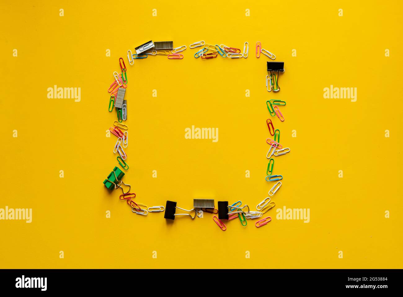 the office writing supplies flat lay in the shape of circle frame with ...