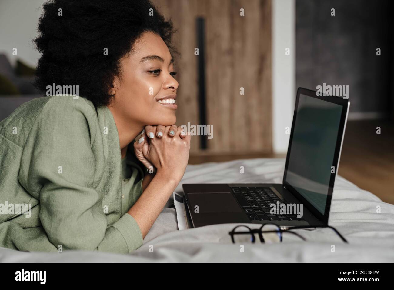 African woman laying in bed hi-res stock photography and images - Alamy