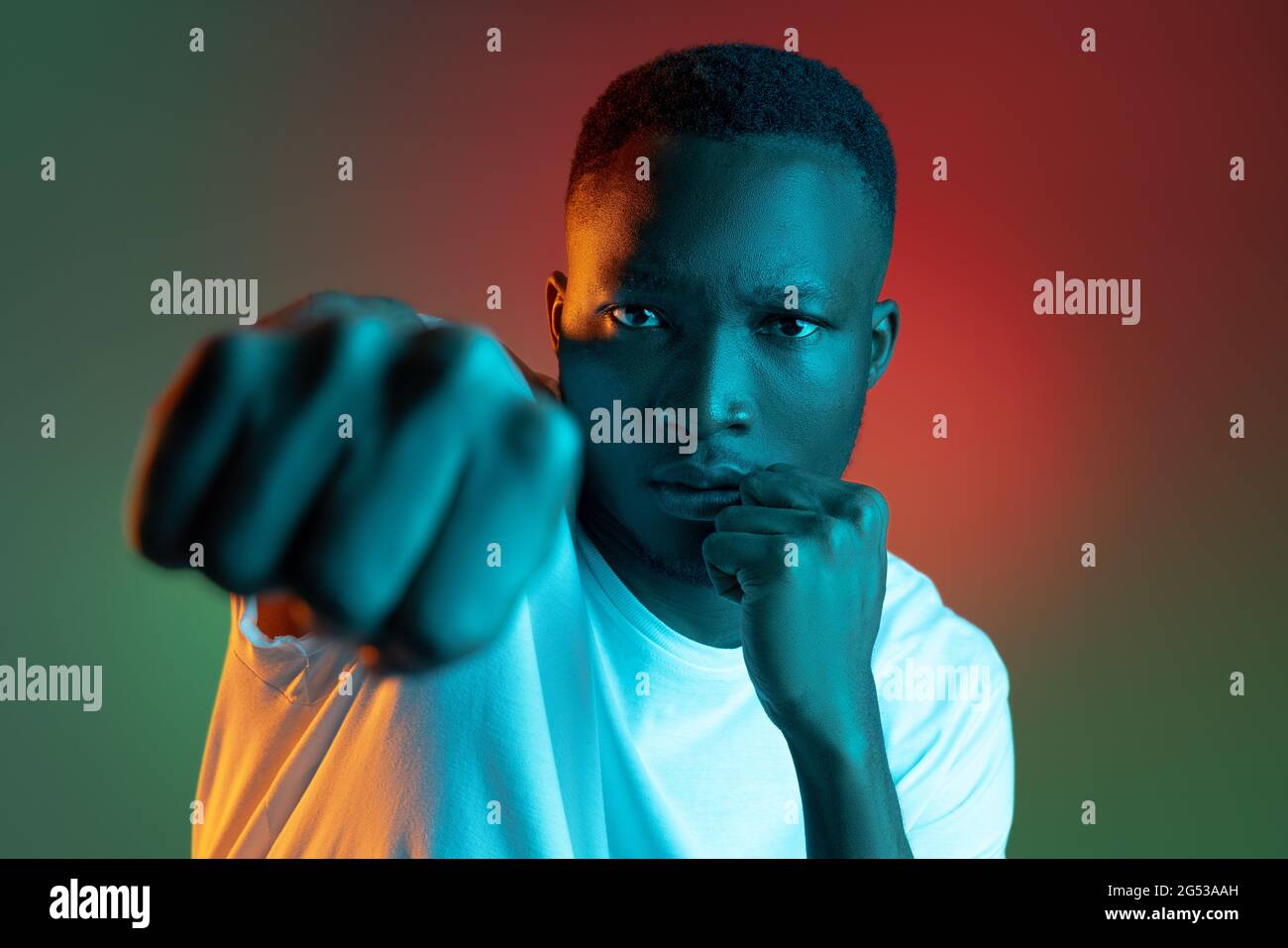 Close up. African young man's portrait on bright studio background in ...