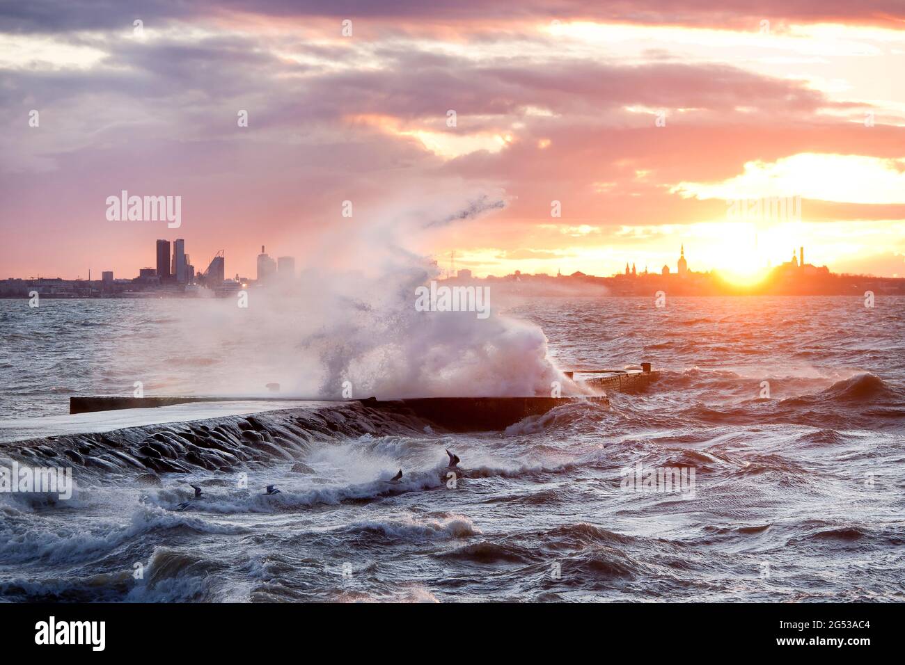 Waves crashing man in ocean sunset hi-res stock photography and images ...