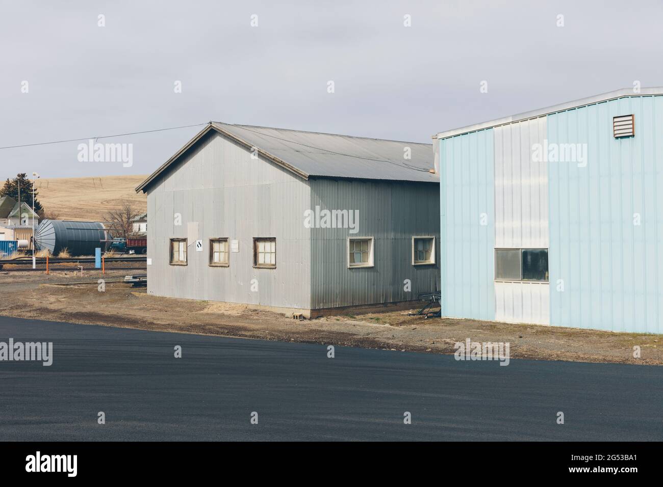 Agricultural storage buildings by a road Stock Photo - Alamy