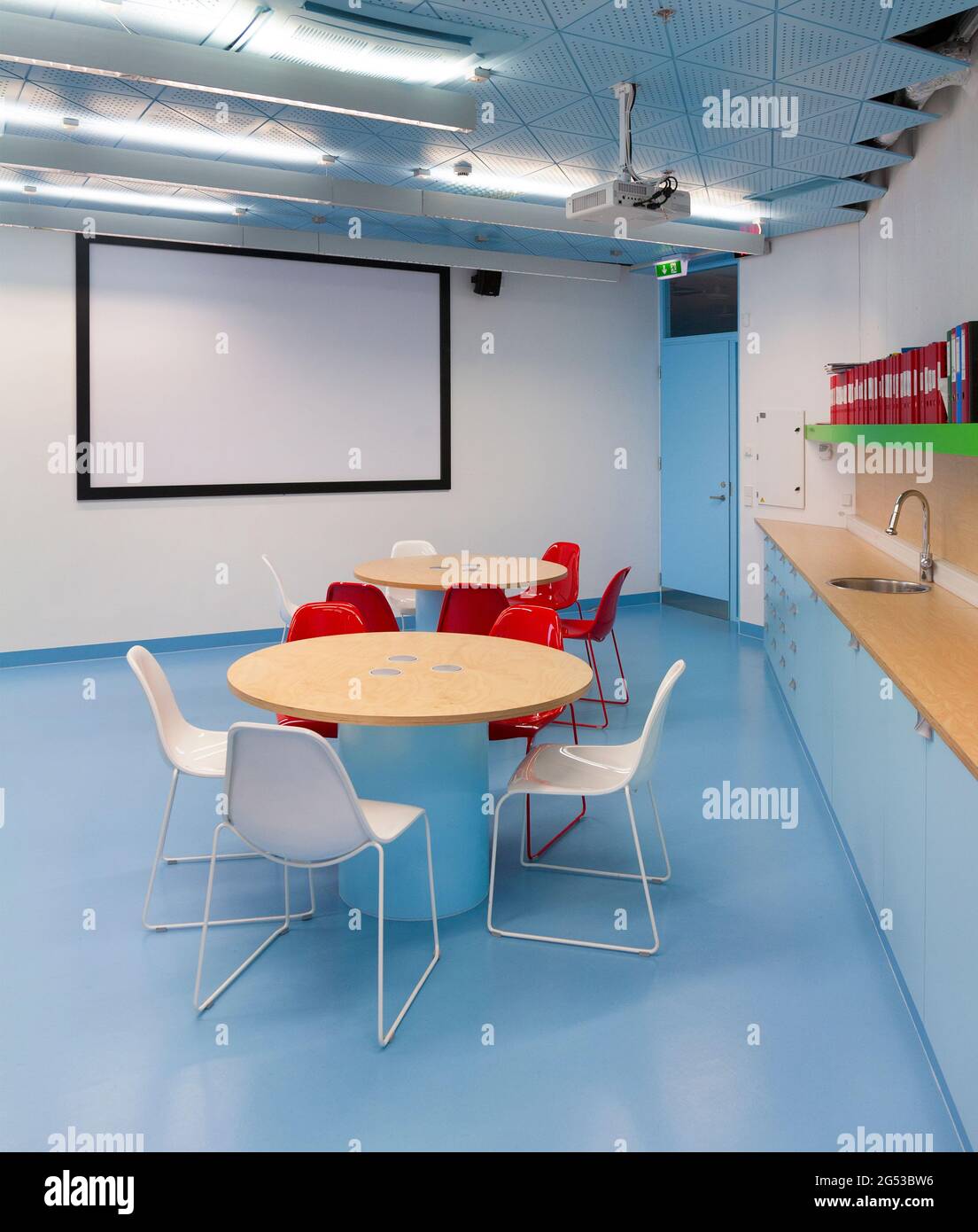 Classroom with white board, round tables and counter and sink Stock ...