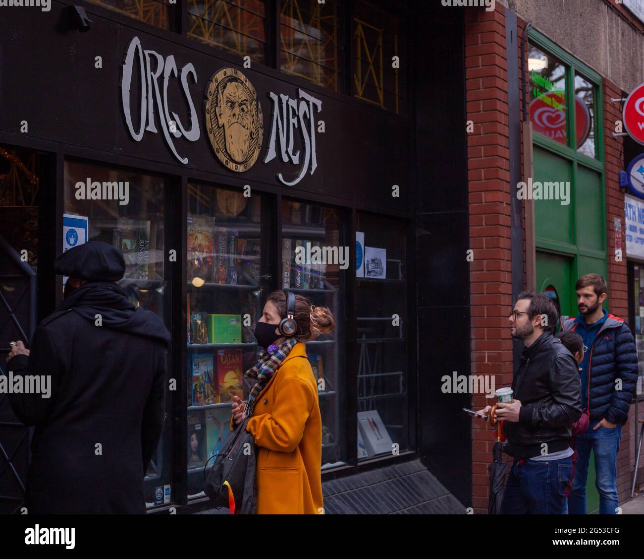 RPG Gaming Concept / Tech Lifestyle - View of several people queuing ...