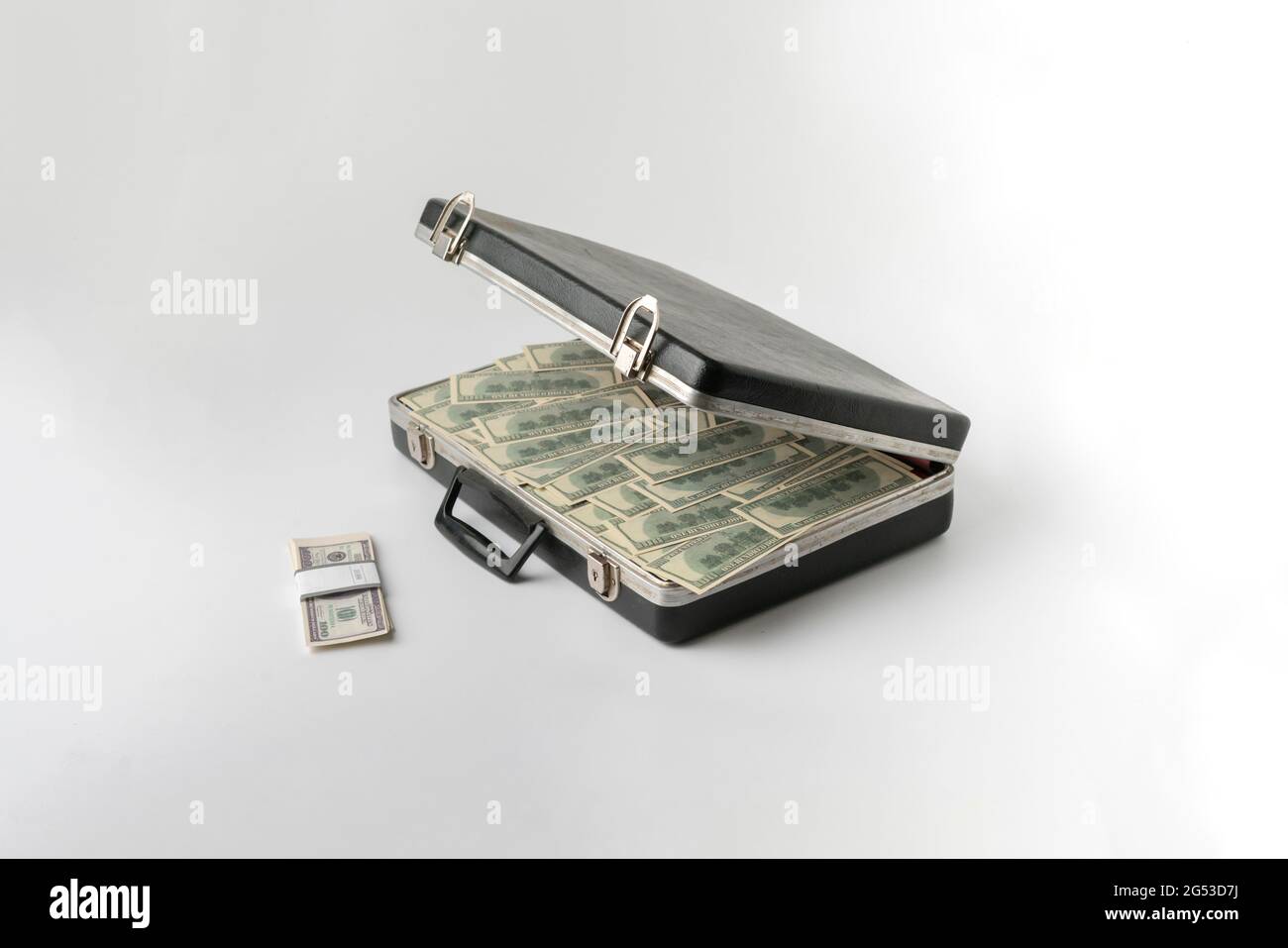 the opened vintage case full of cash dollar money, hundred banknote on ...