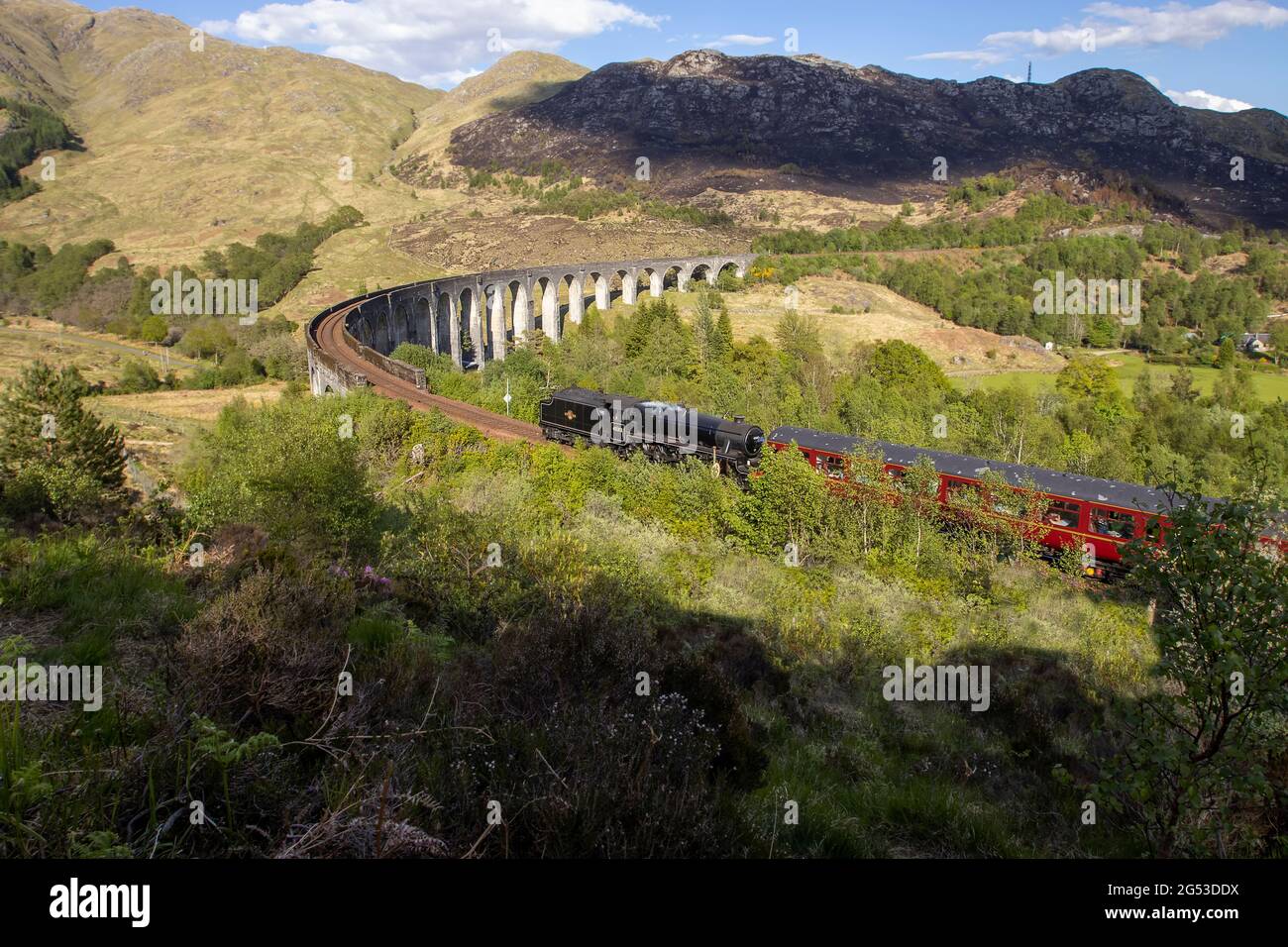 The Jacobite Steam Train crossing the Glenfinnan Viaduct near Fort ...
