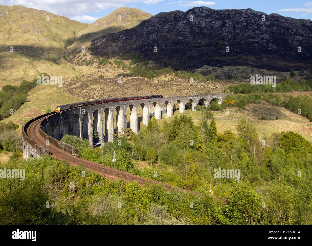 The Jacobite Steam Train crossing the Glenfinnan Viaduct near Fort ...