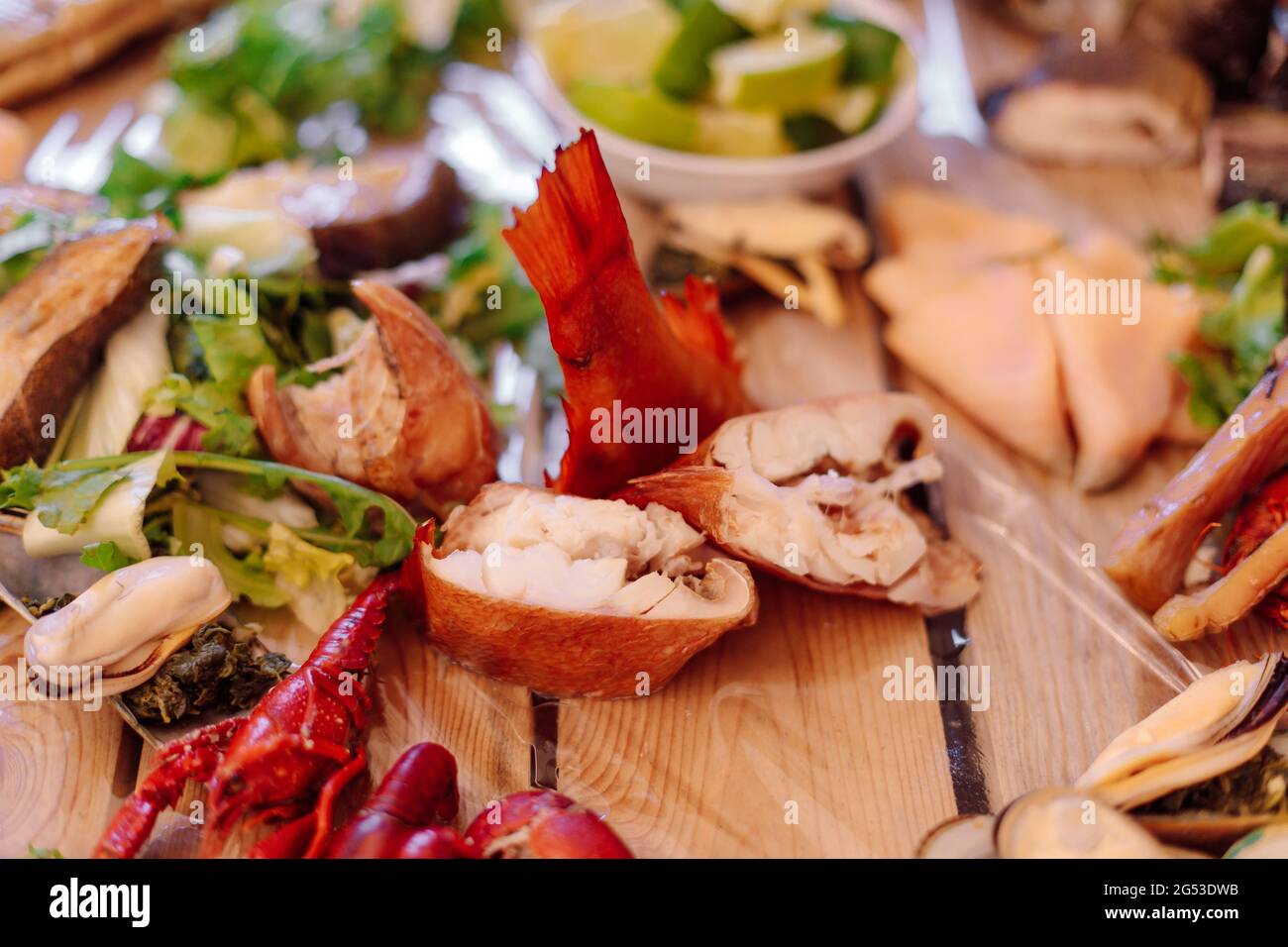 Various fish snacks on wooden tray in restaurant. Delicious and healthy ...
