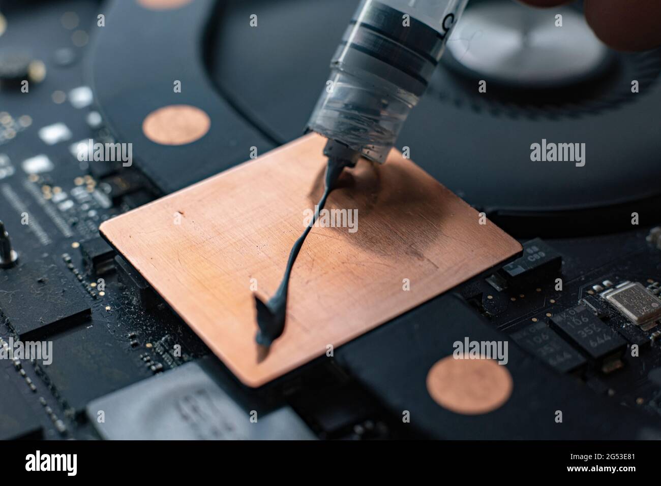 applying the thermal grease to the gpu chip for better heat management ...