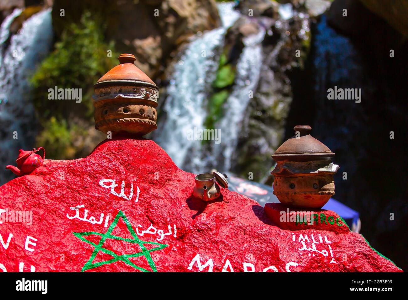 Two moroccan Tajines in front of a big waterfall in Imlil Morocco Stock ...