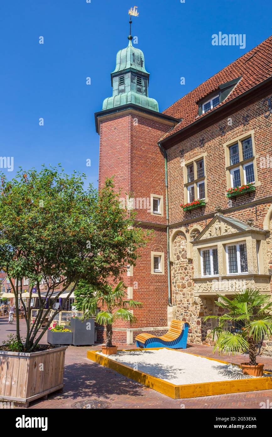 Little beach with palm tree and beach chair in front of the city hall ...