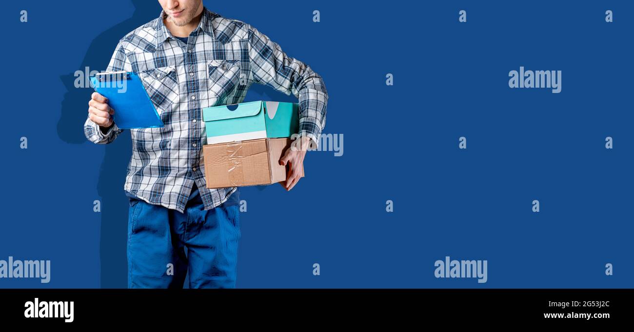 young male postman deliver the mail box with things inside standing ...