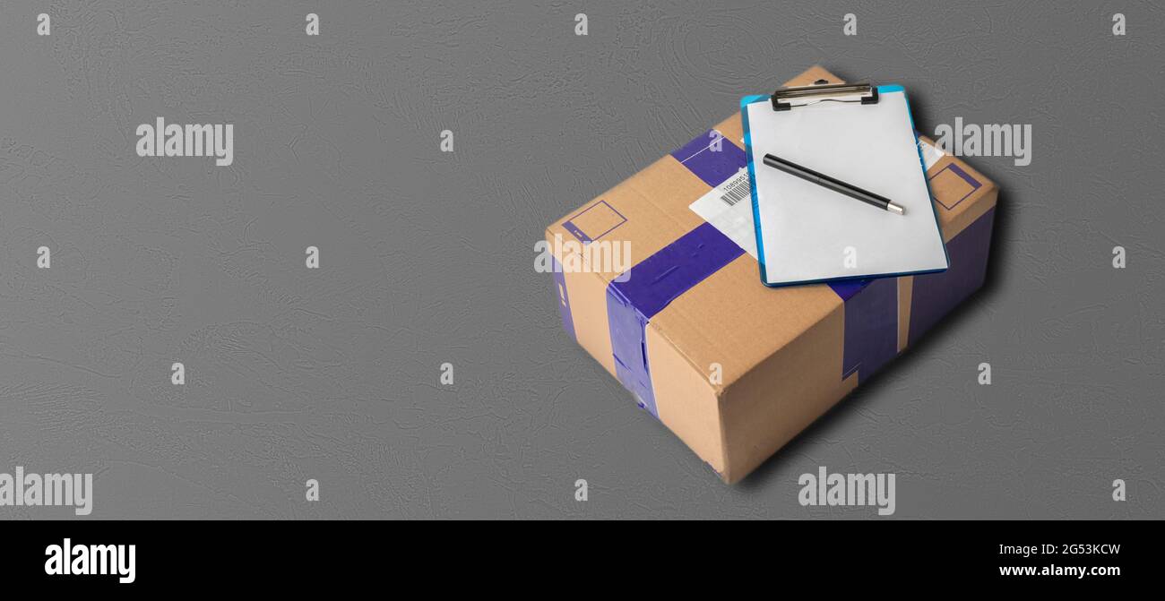 a simple box delivery on color surface table, sending mail with things ...