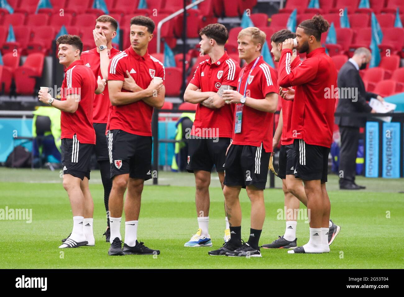 Wales' Daniel James (left) and Chris Mepham (2nd left)during the ...