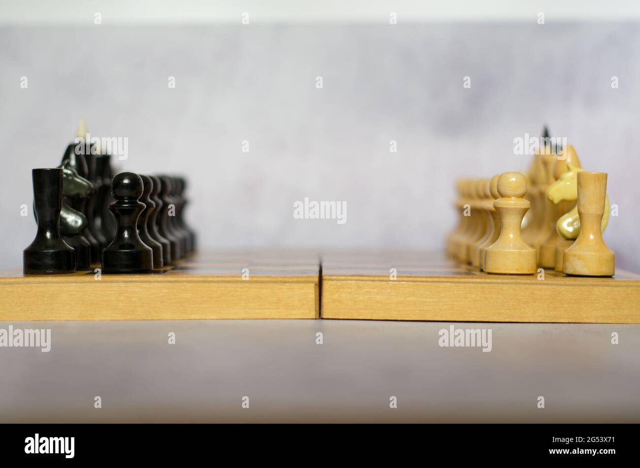 Chess pieces on a chessboard side view, selective focus Stock Photo - Alamy