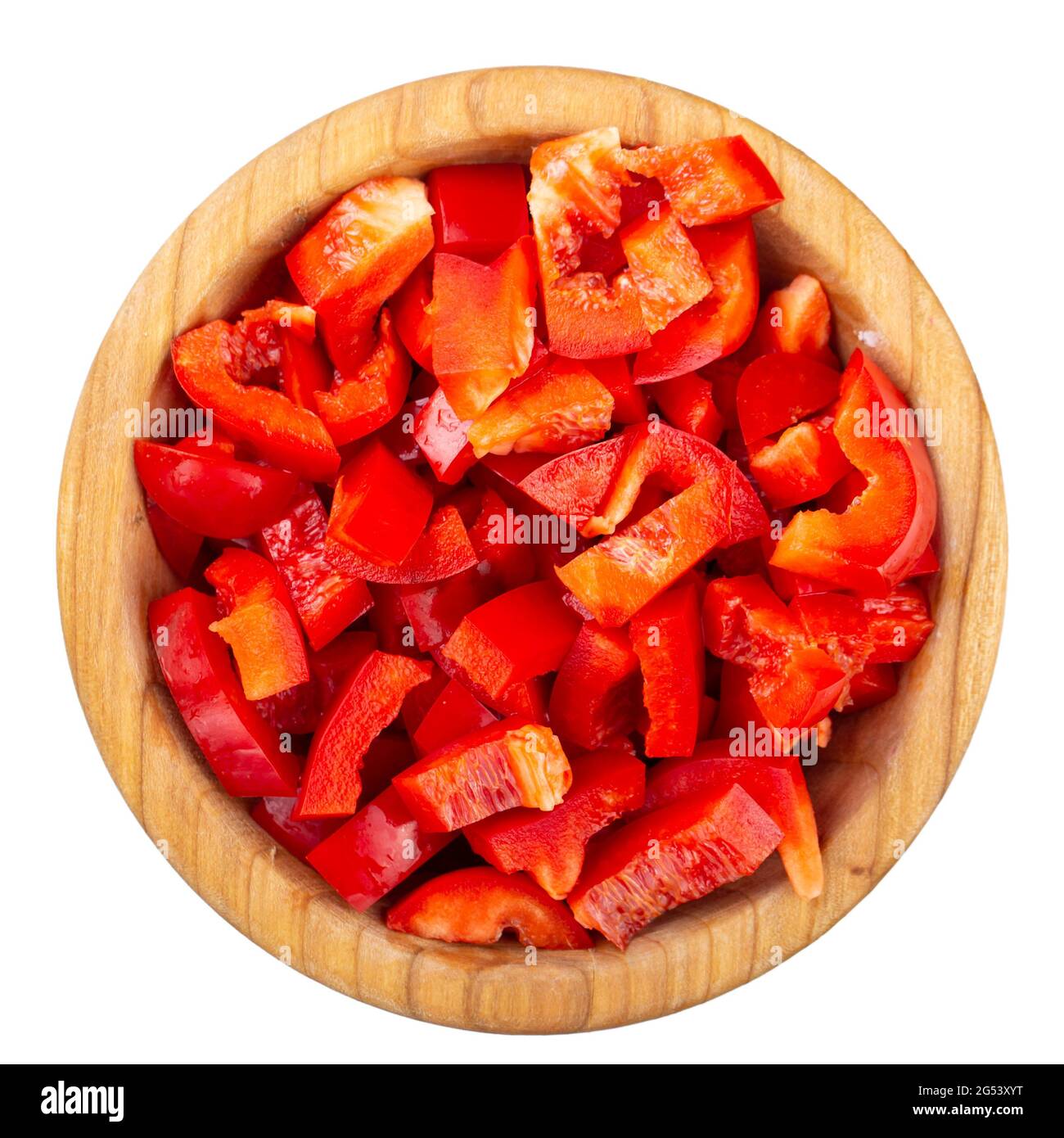 Sliced red bell pepper in a wooden bowl isolated on white background ...