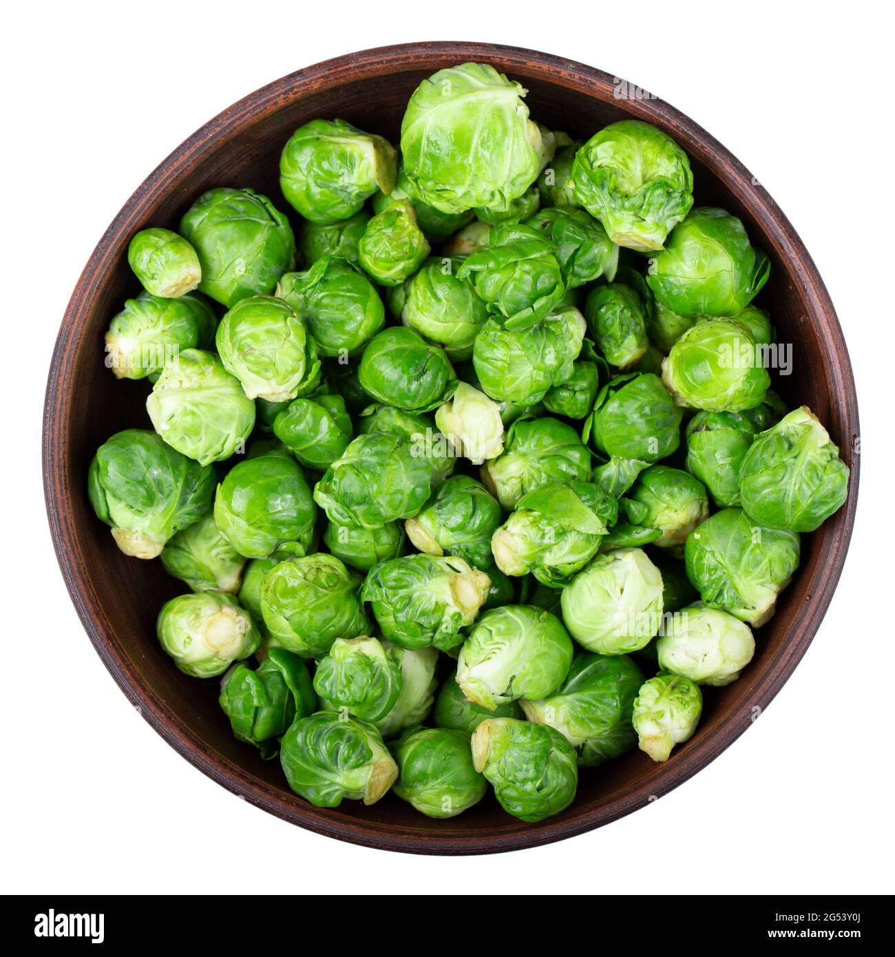 Brussel sprout or Rosenkohl in German language in a clay bowl on a ...